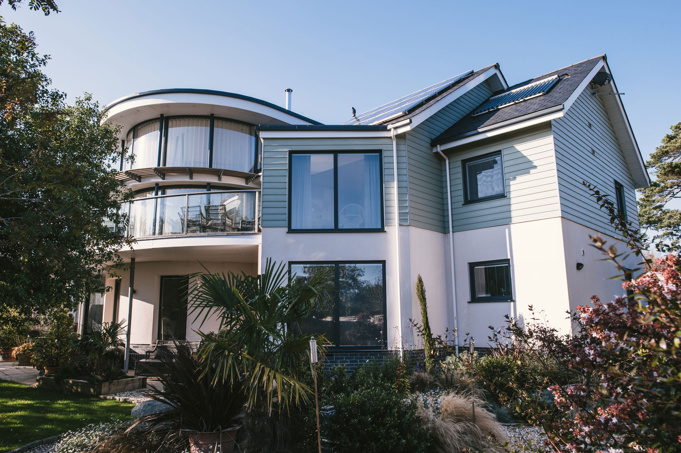 Curved Windows and Sliding Doors for Panoramic Sea Views in Devon New ...